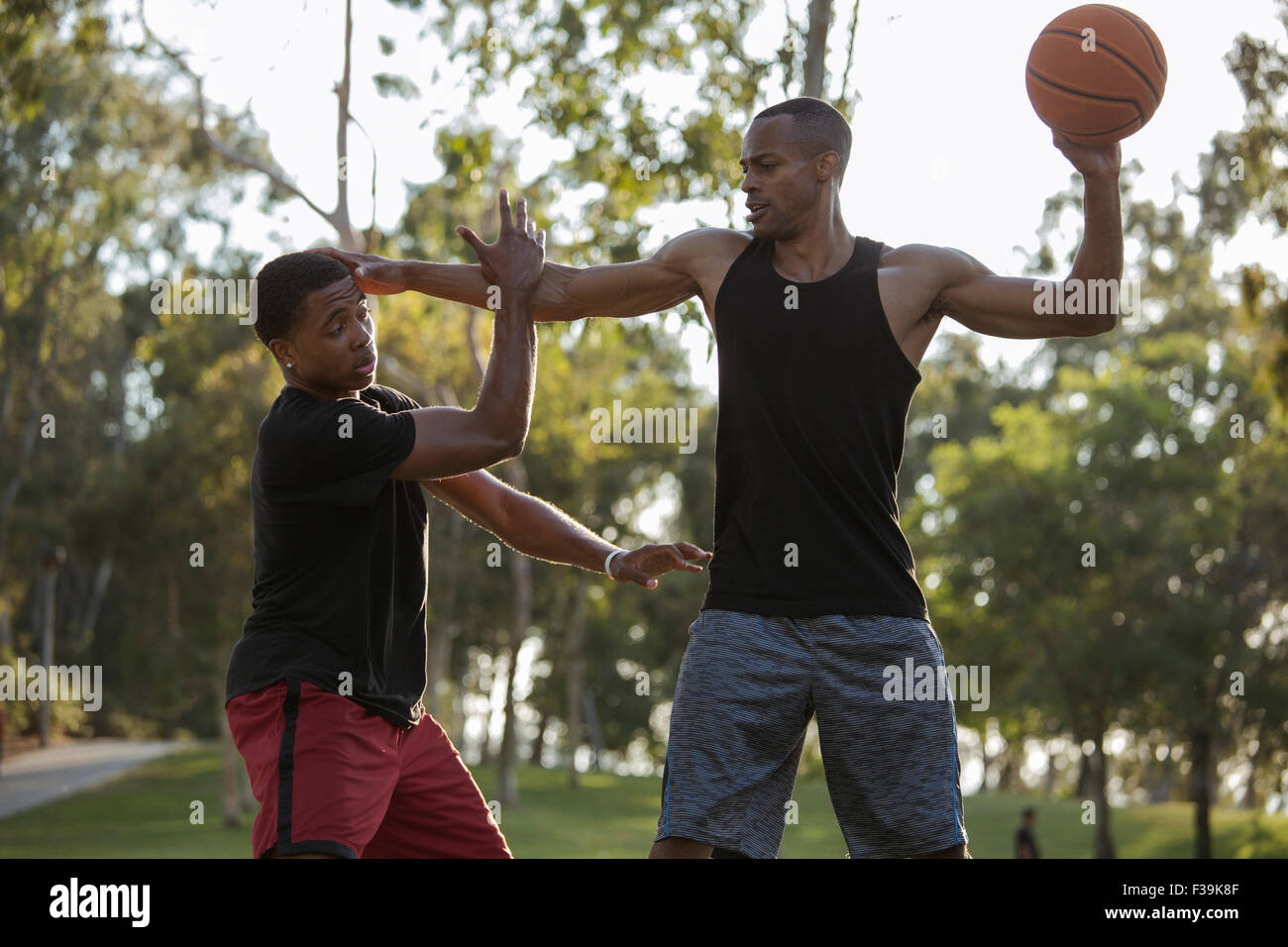 Holding back hi-res stock photography and images - Alamy