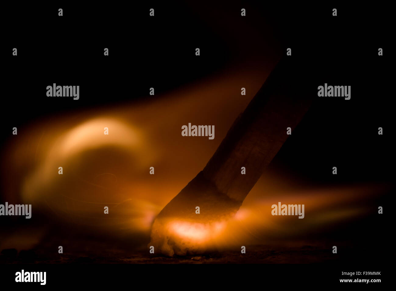 Struck Match shows motion, fire, and black background Stock Photo - Alamy