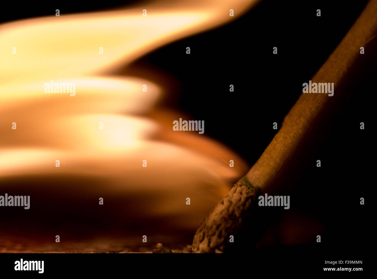 Struck Match shows motion, fire, and black background Stock Photo - Alamy