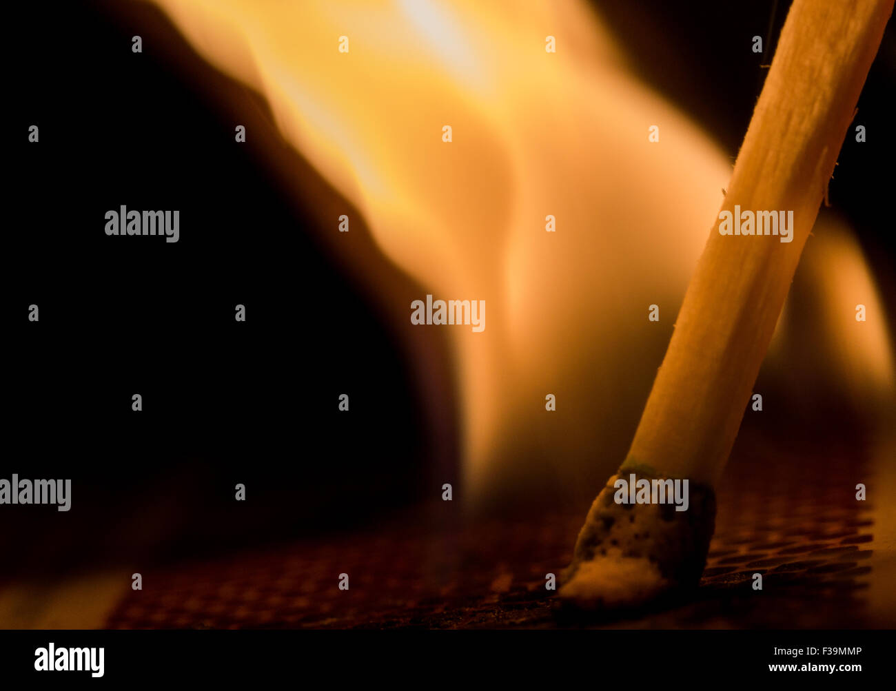 Struck Match shows motion, fire, and black background Stock Photo - Alamy
