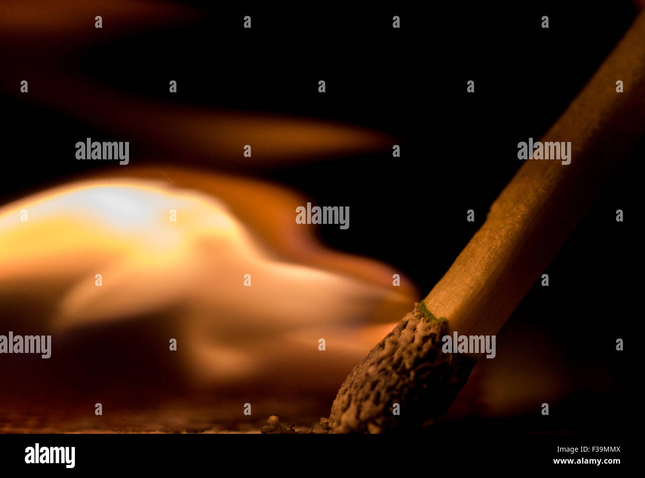 Struck Match shows motion, fire, and black background Stock Photo - Alamy