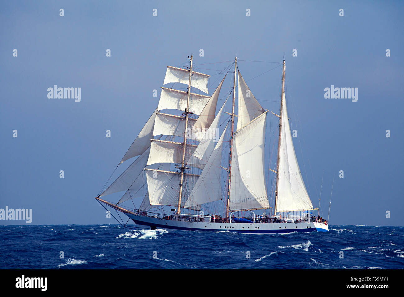 Barquentine with white sails in the calm sea Stock Photo - Alamy