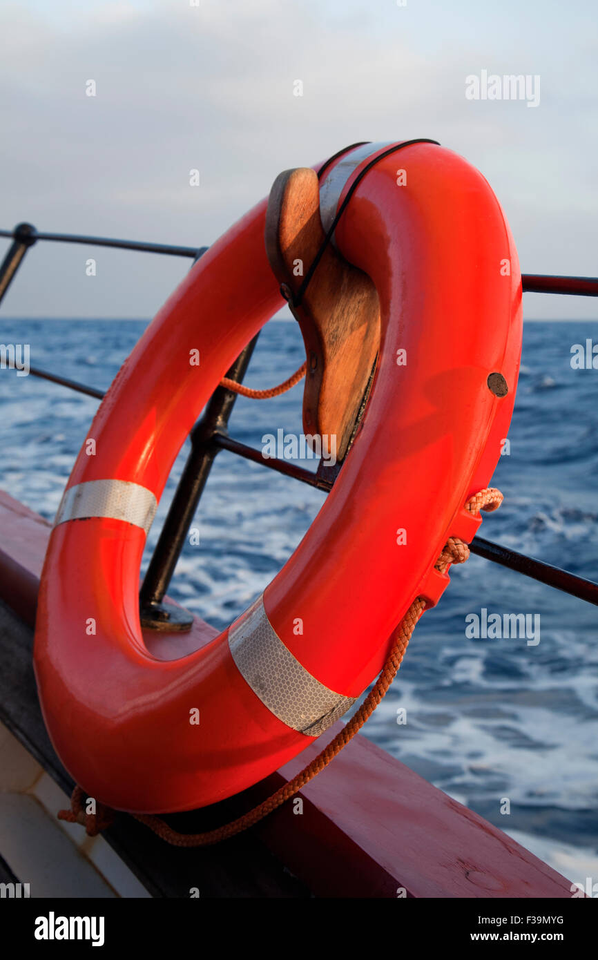 Orange lifesaver hanging on a bord of a sailing ship Stock Photo - Alamy