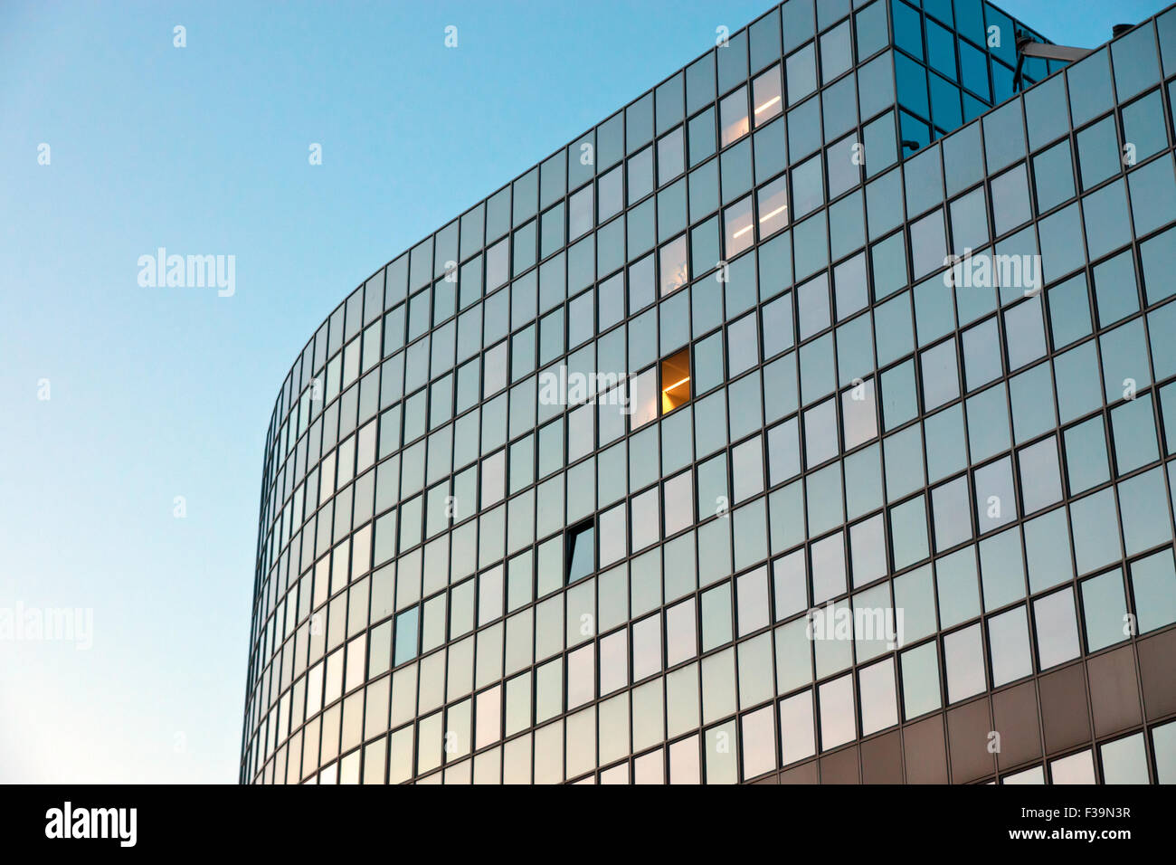 A modern office building at sunrise in the early morning Stock Photo ...