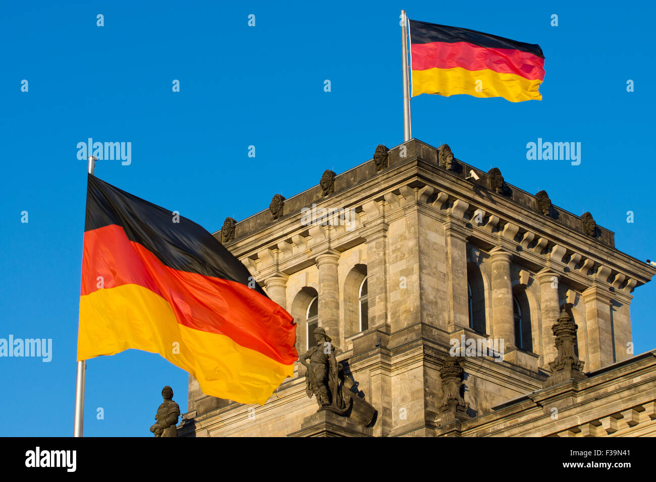 Two german flags waving on one of the corners of the Reichstag in ...