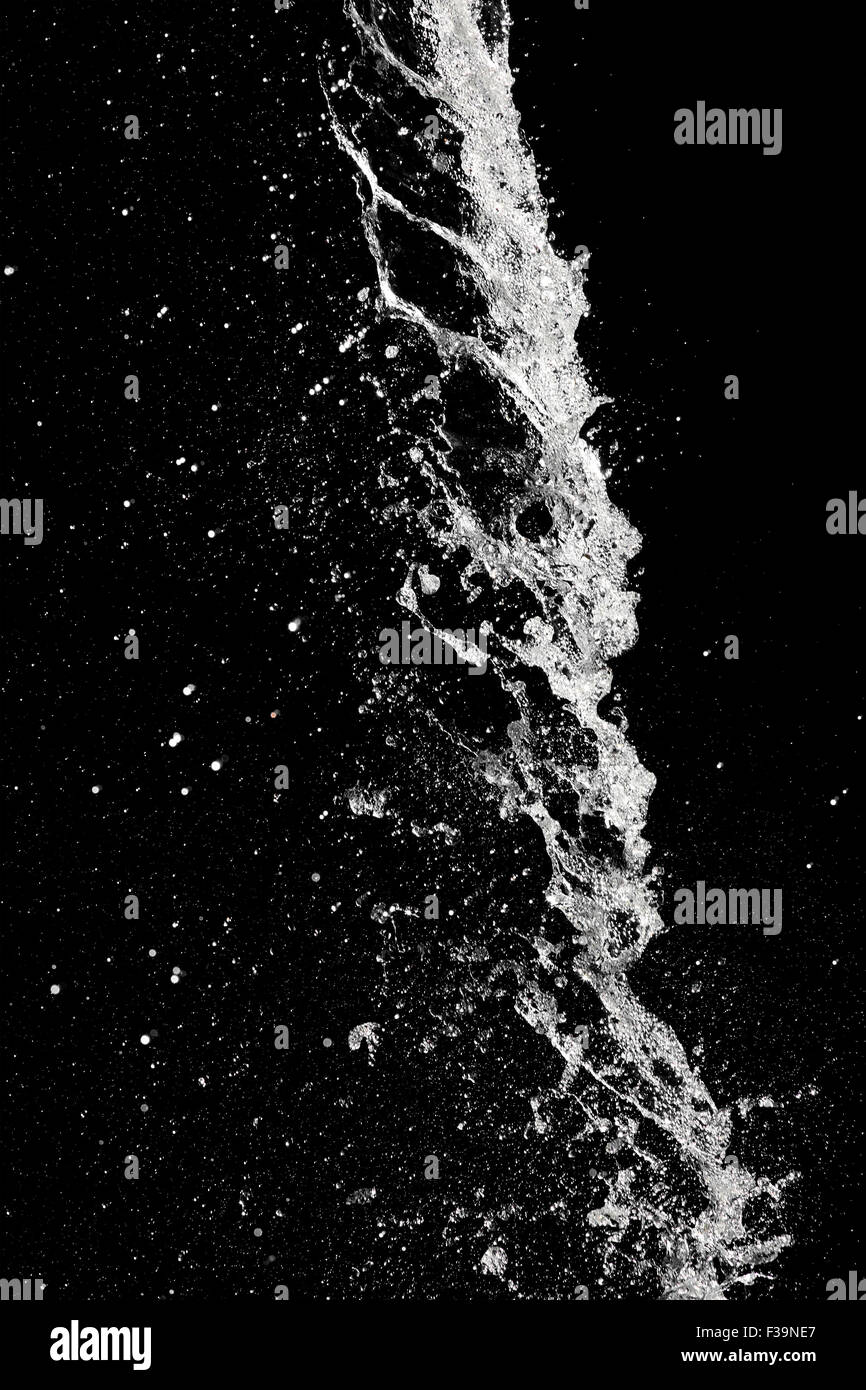 Splash of pouring water isolated over black background Stock Photo - Alamy