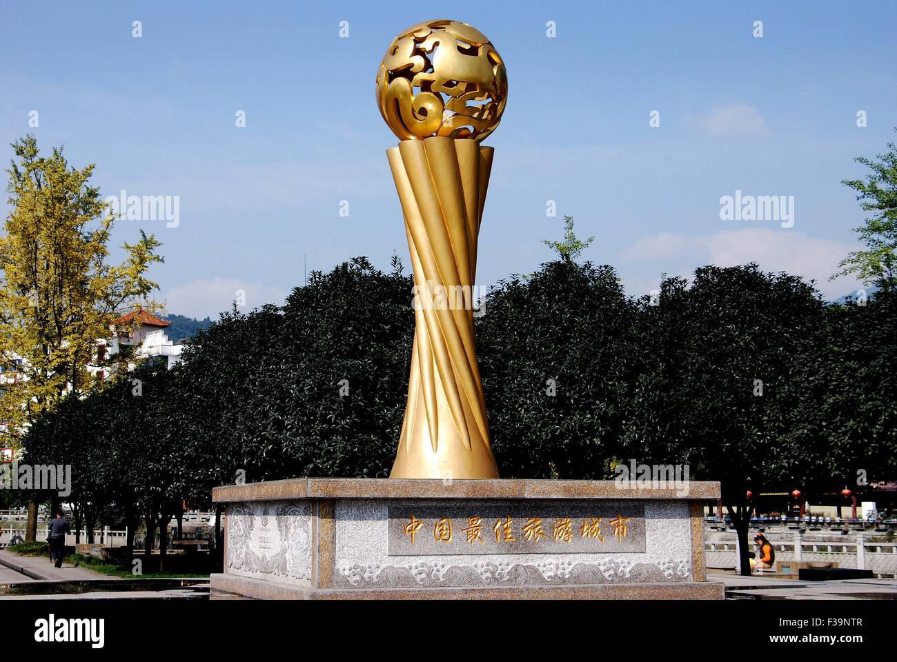 Dujiangyan, China: Gilded column and sculpted orb stand on a square ...