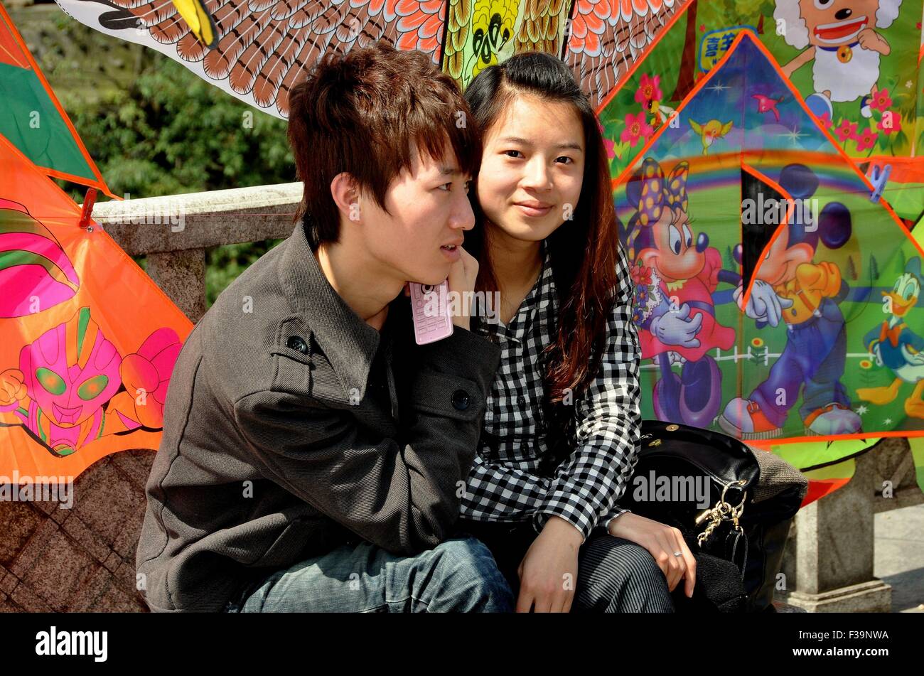 Dujiangyan, China: Romantic young Chinese couple sitting next to a ...