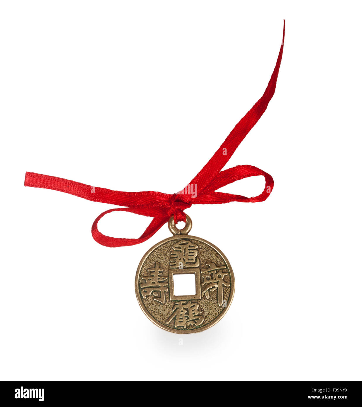 old Chinese coin with a red ribbon isolated on white background Stock ...