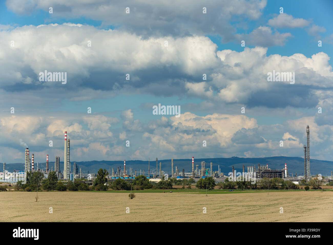 Refinery and its impact on the environment Stock Photo - Alamy