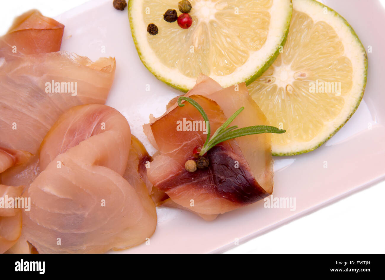 Smoked swordfish on the tray on white background seen from above and ...