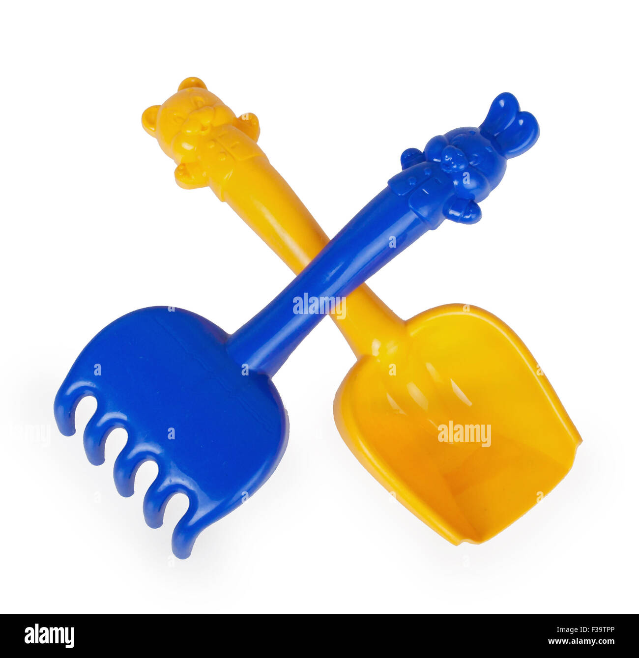 plastic shovel and rake isolated on a white background Stock Photo - Alamy