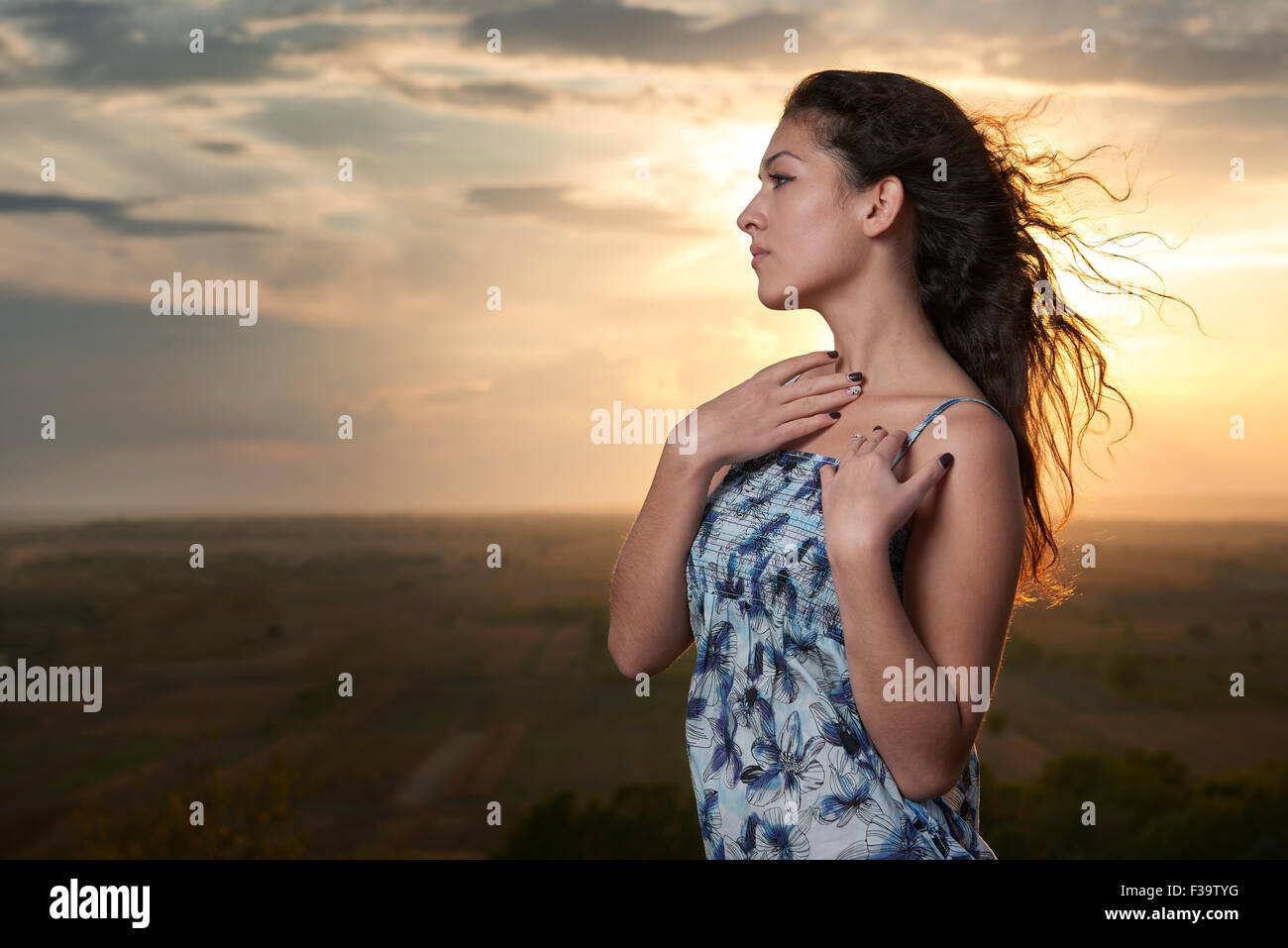 girl portrait at sunset on plain background Stock Photo - Alamy