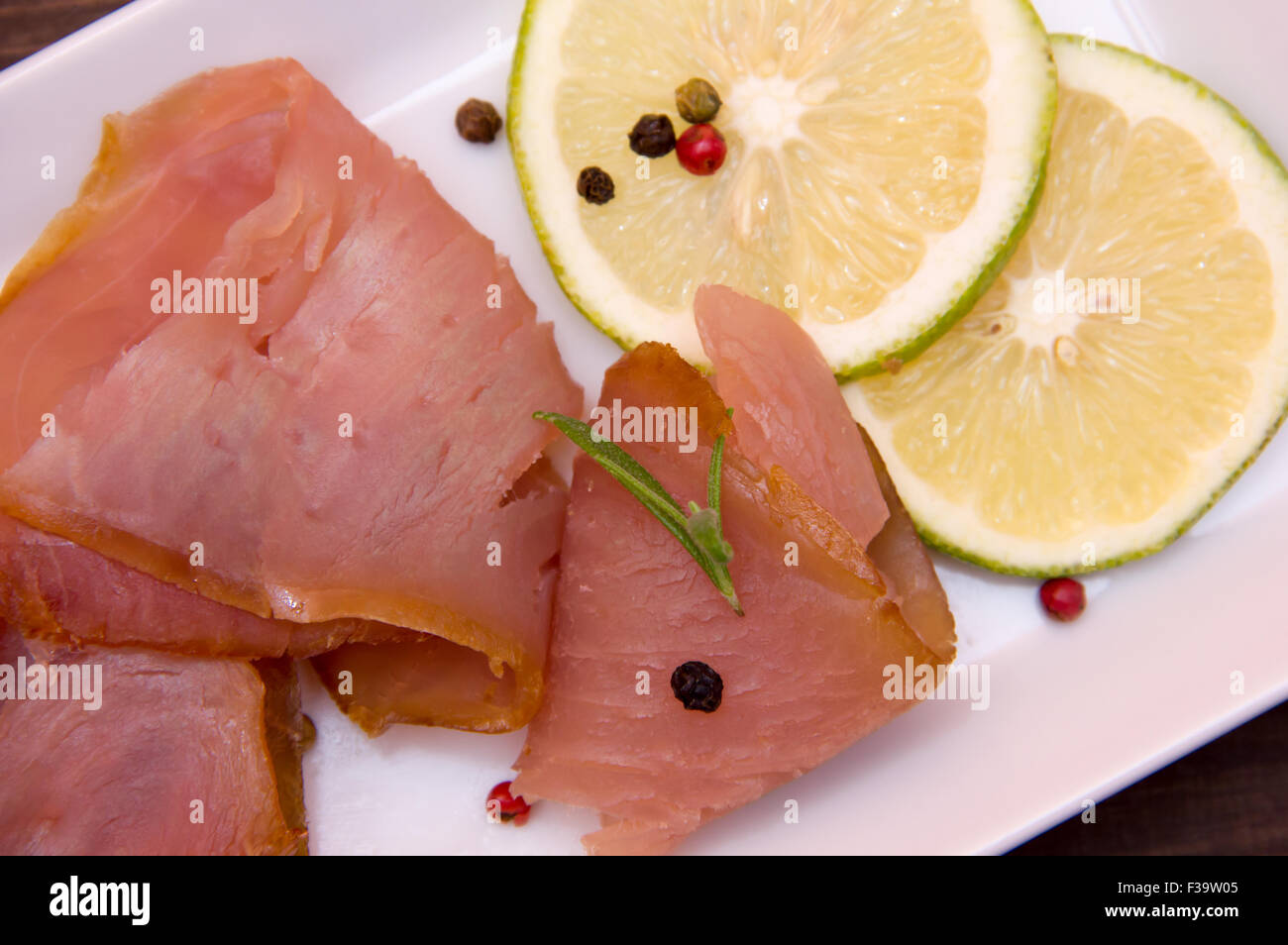 Smoked tuna on tray on wooden table seen from above and close Stock ...