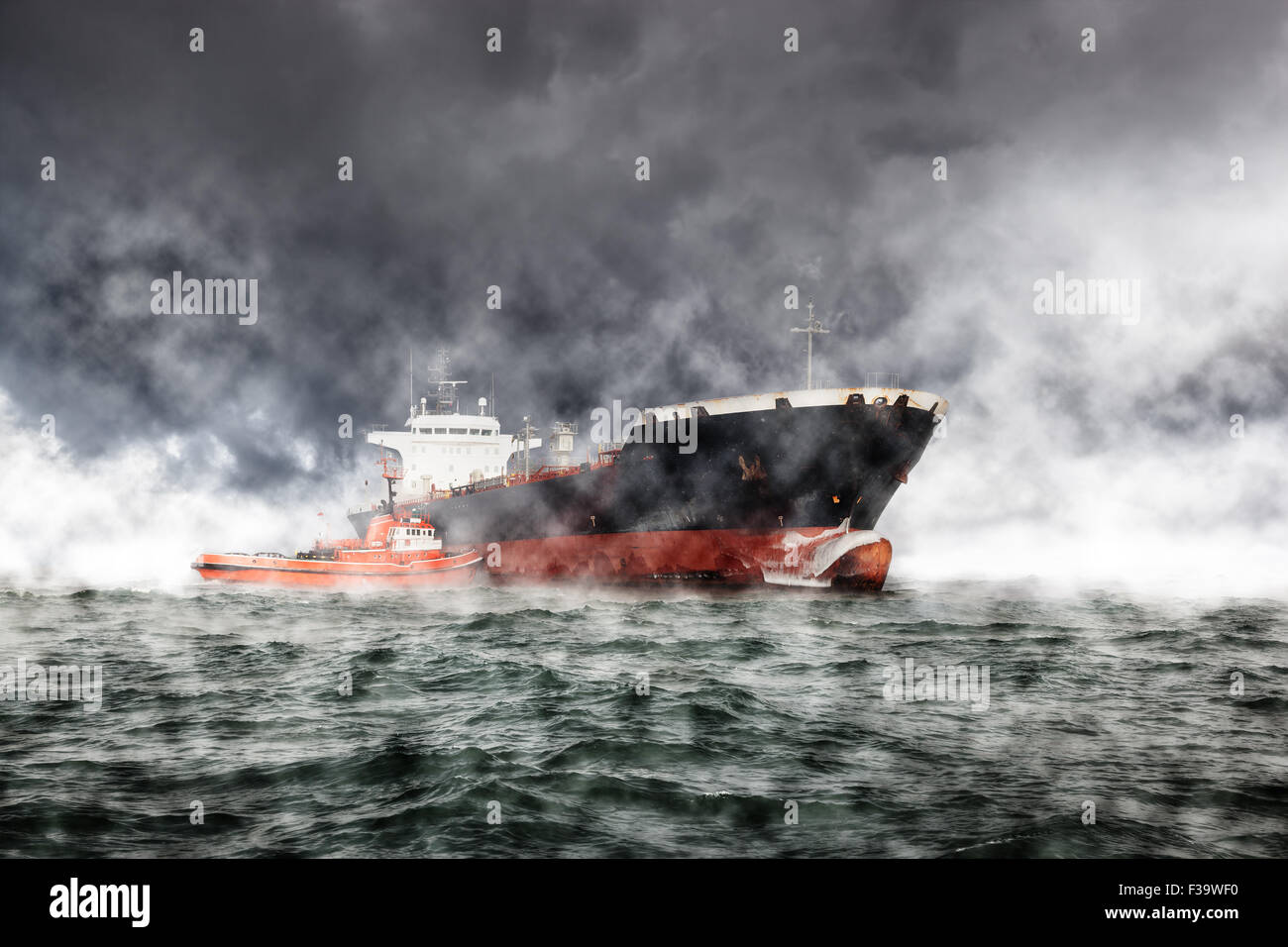 Cargo ship at sea during a storm Stock Photo - Alamy