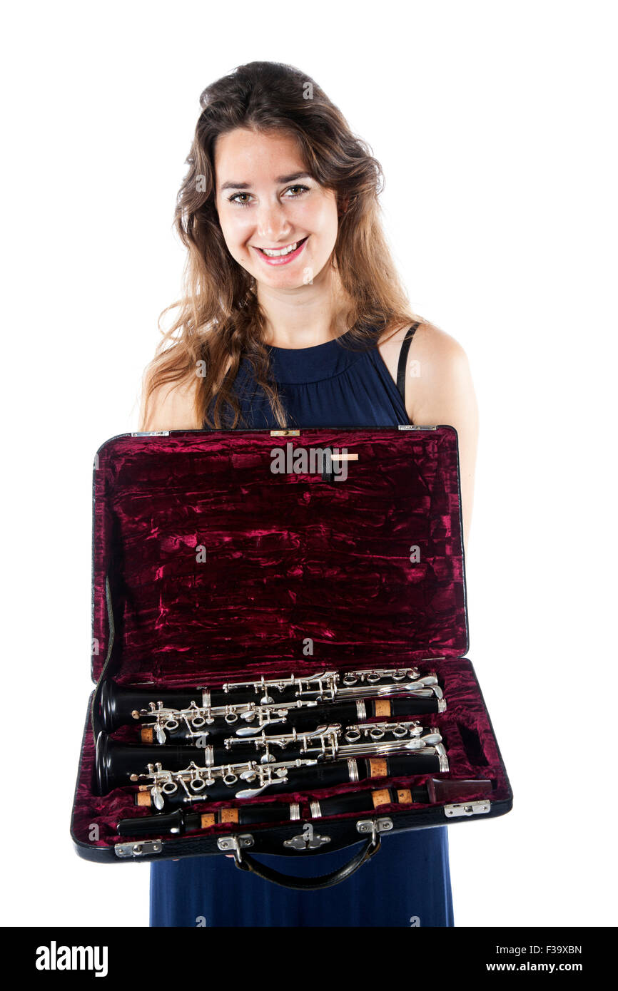 young woman shows clarinet in open case and smile with velvet lining in ...