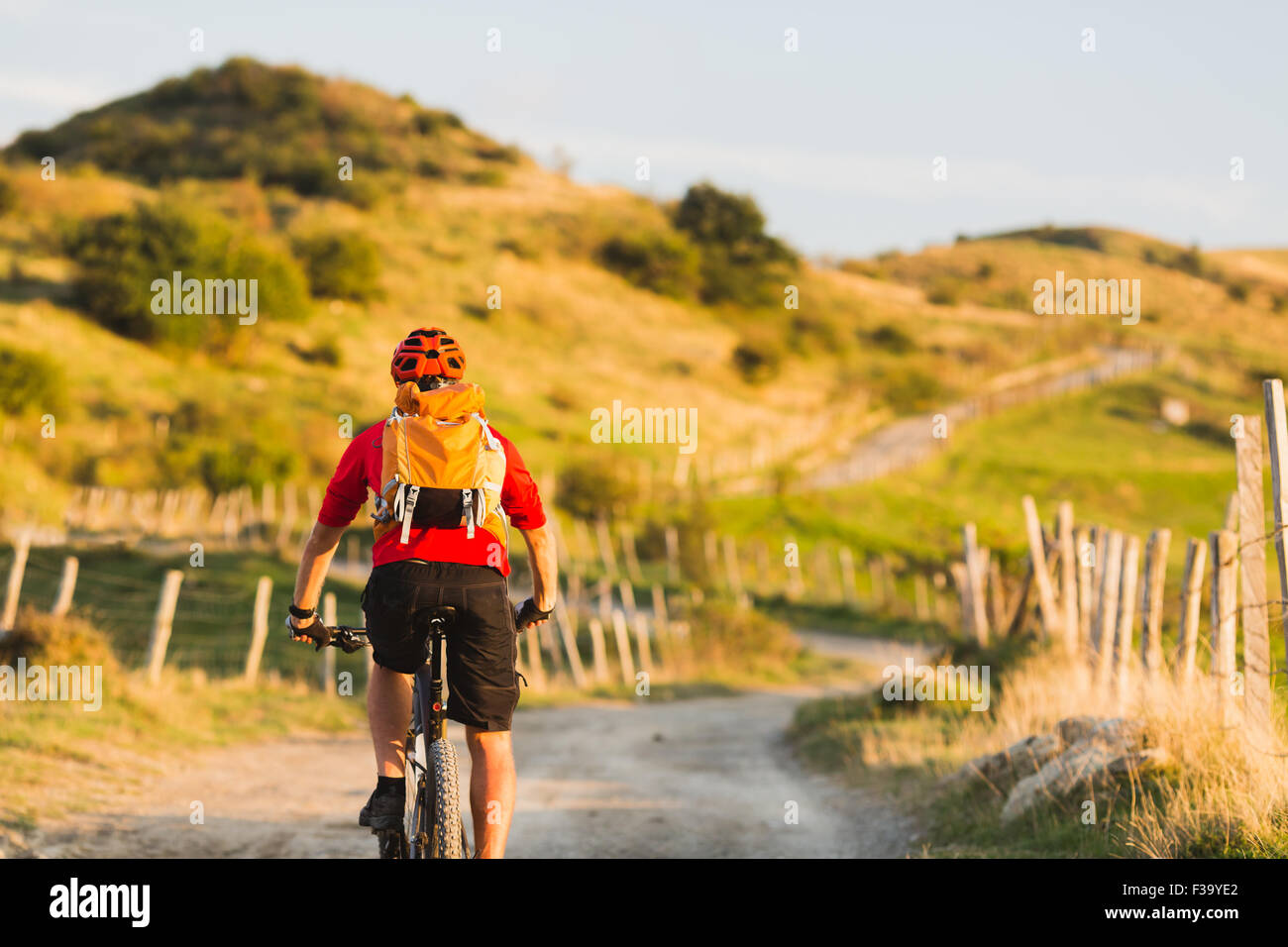 Bicycle riding enduro adventure in sunset summer mountains landscape ...