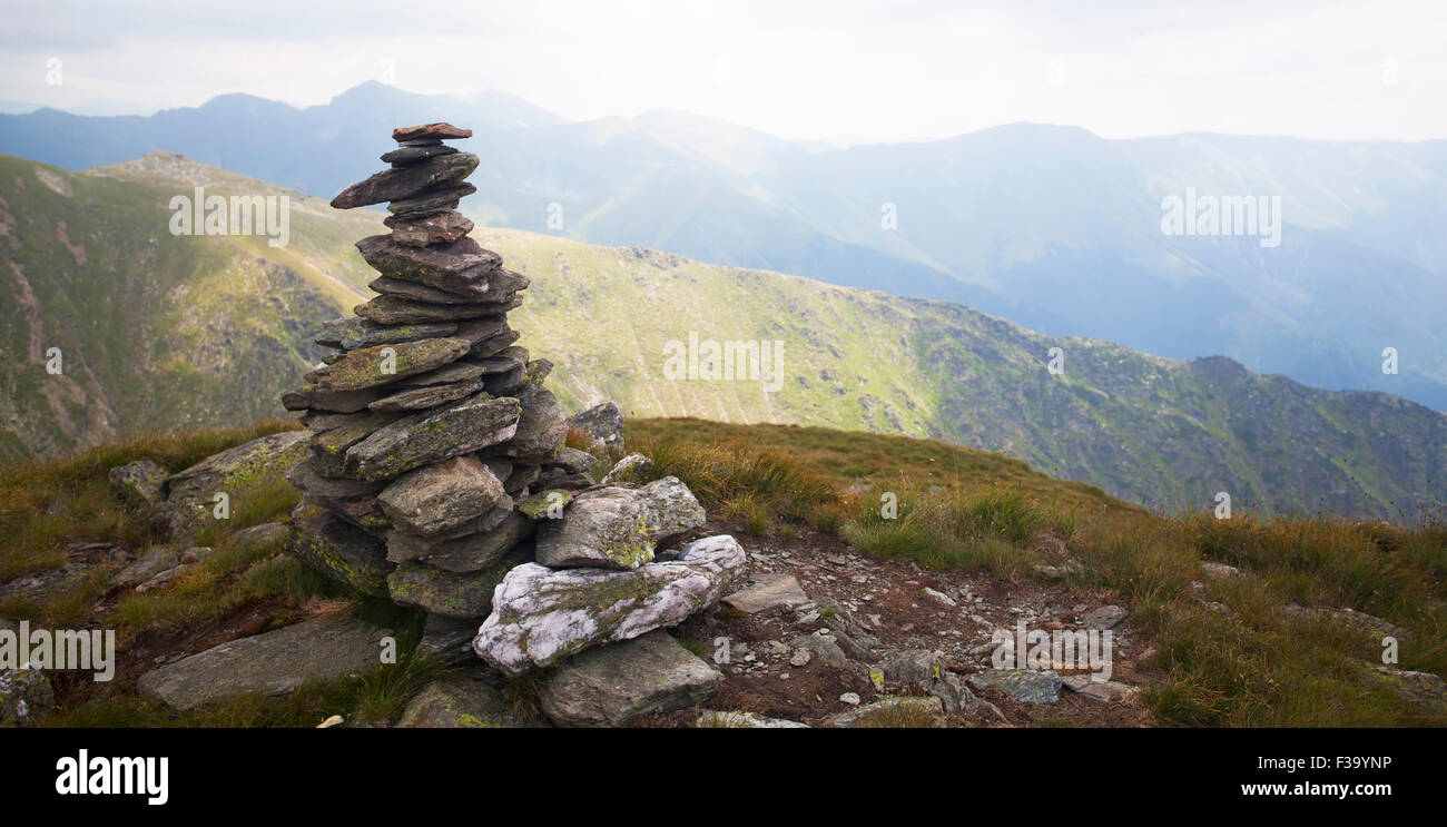 Stack Of Stones in the wild mountains Stock Photo - Alamy