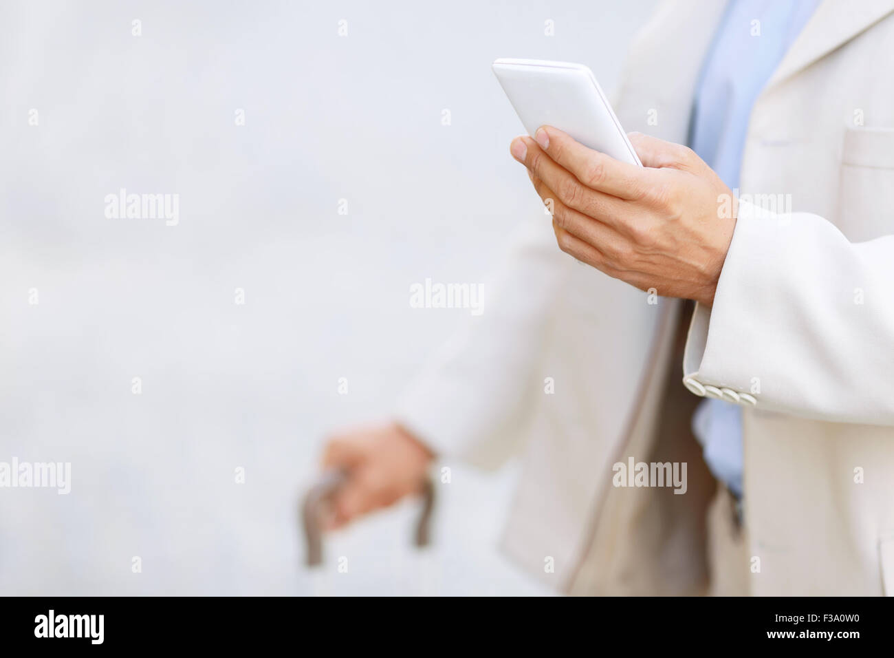 Lets make a call. Close up of mobile phone in hands of adult man ...