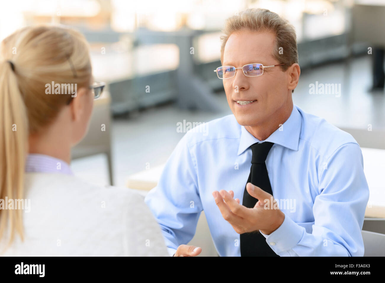 Involved in conversation. Nice positive talkative businessman ...