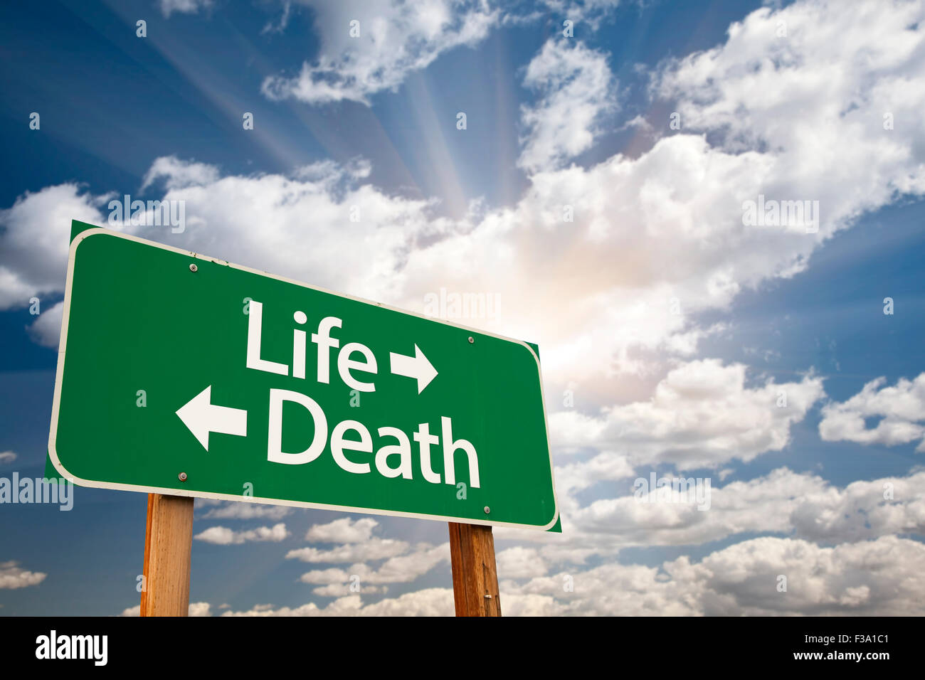 Life and Death Green Road Sign With Dramatic Clouds and Sky Stock Photo ...