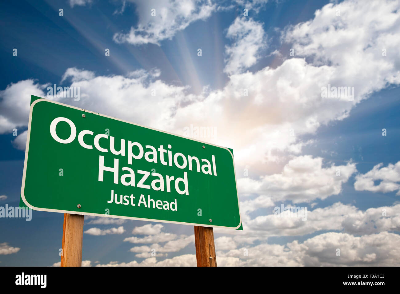 Occupational Hazard Green Road Sign With Dramatic Clouds and Sky Stock ...
