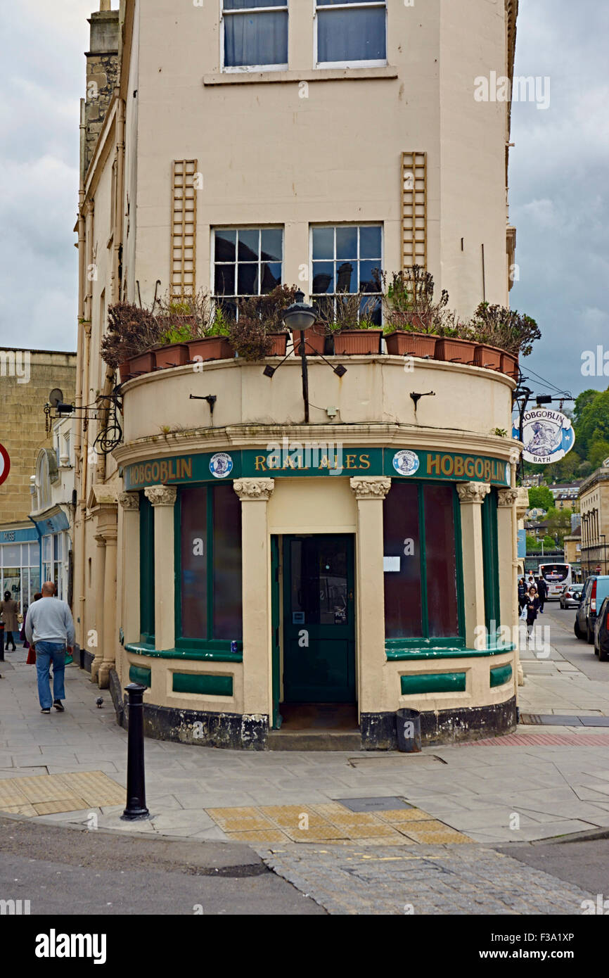 Frontal view of narrow pub entrance, street running alongside both ...