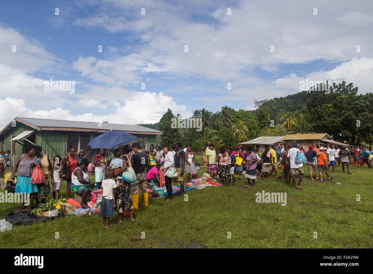 Batuna, Solomon Islands - May 28, 2015: People buying and selling food ...