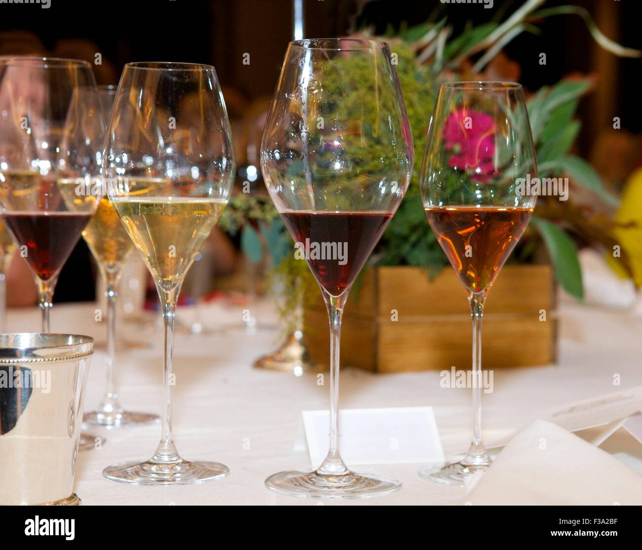 half empty wine glasses at the end of the party Stock Photo - Alamy