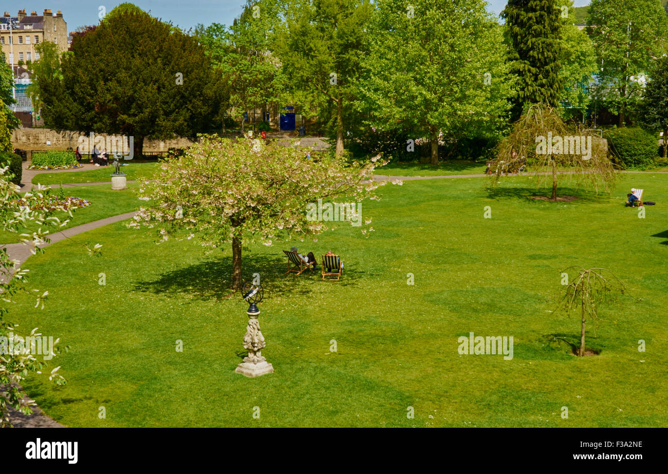 Overhead view Lawns and trees in public garden, people sitting on ...