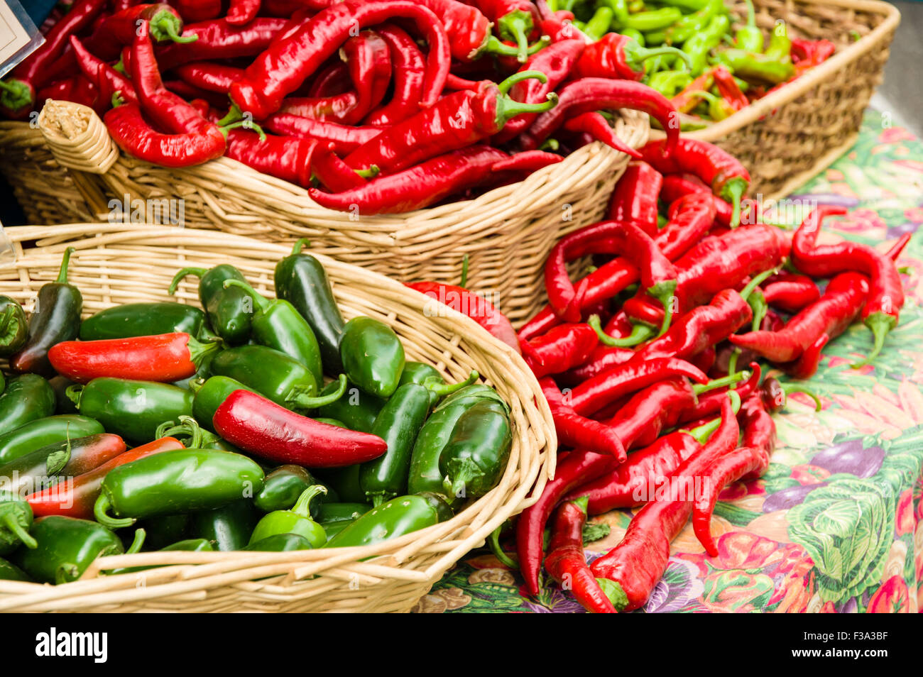 Red hot peppers in baskets displayed at the farm market Stock Photo - Alamy