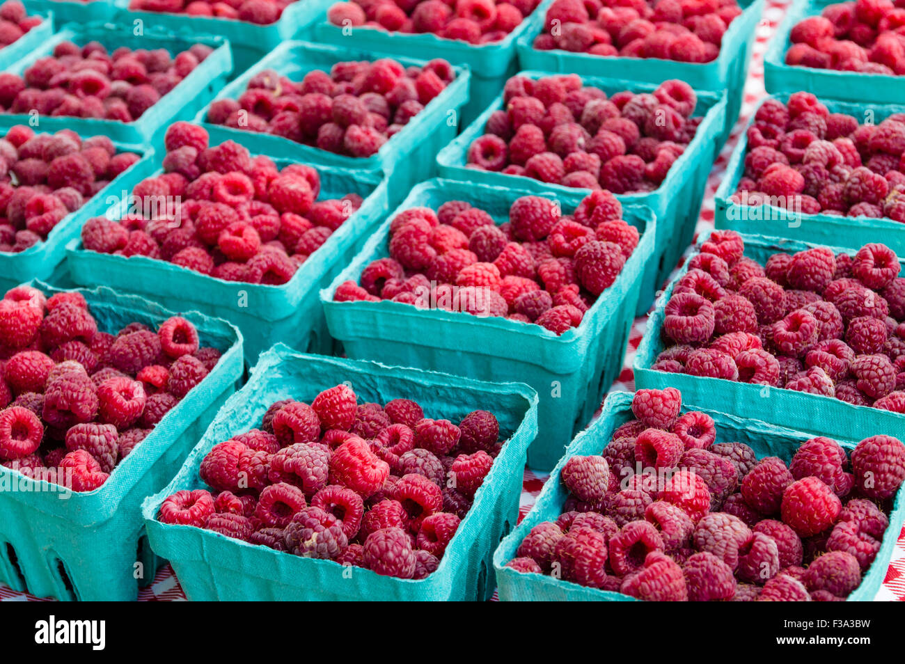 Ripe red raspberries in boxes at the farm market Stock Photo - Alamy
