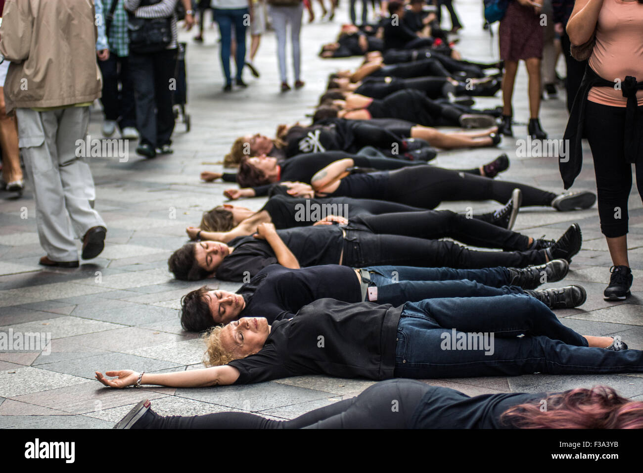Madrid, Spain. 02nd Oct, 2015. Women lay down on the floor during a ...