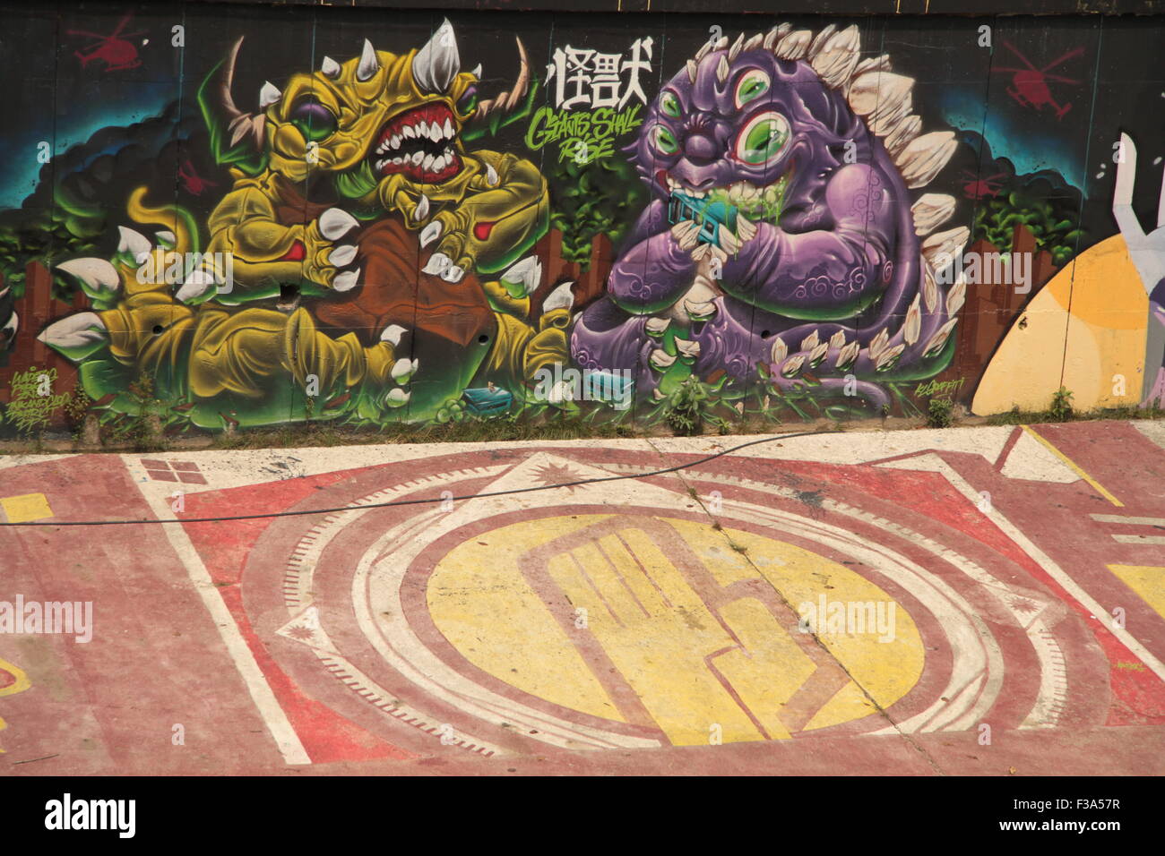 Street art of monsters in urban drain Stock Photo - Alamy