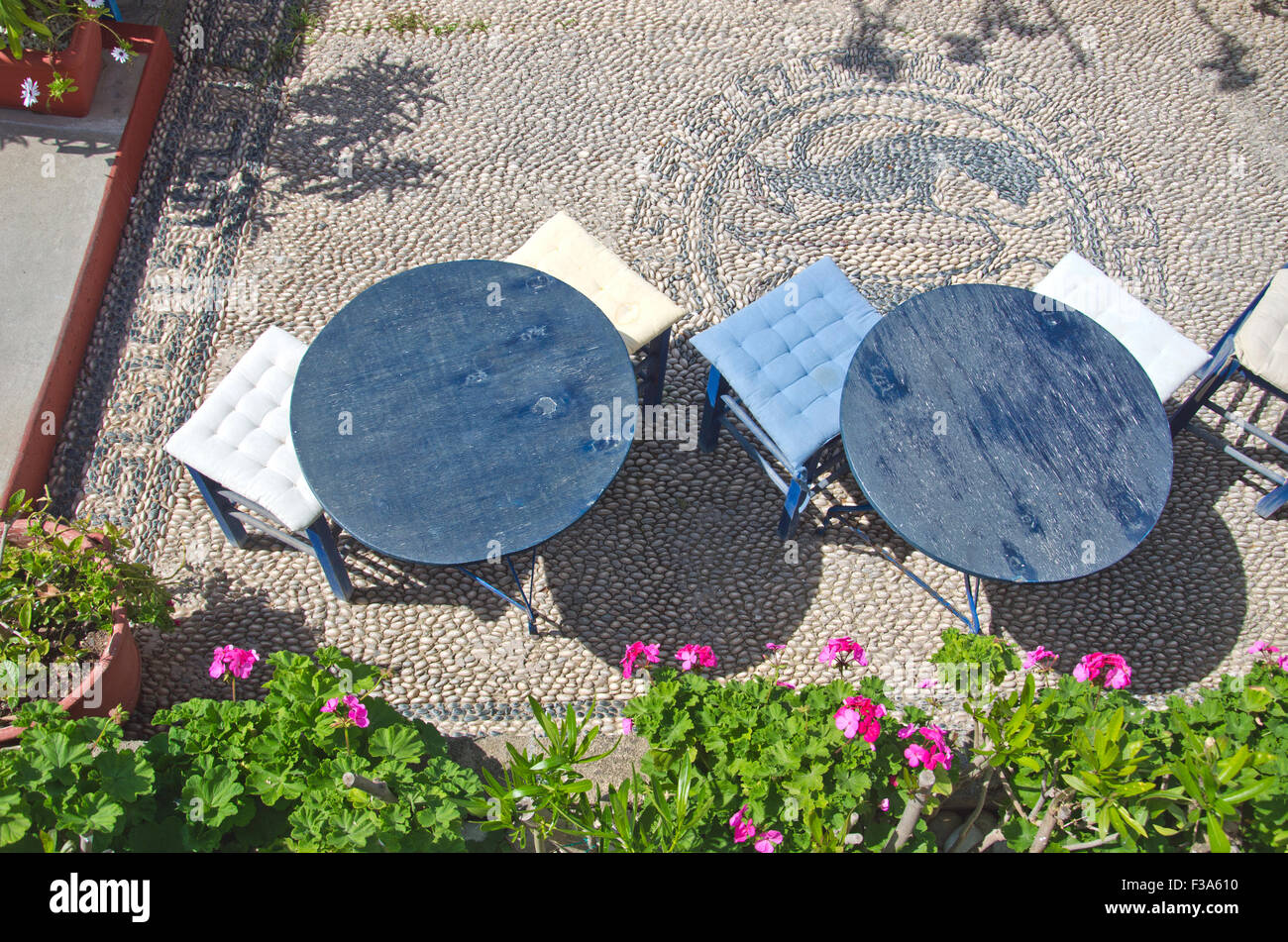 Caffe from above with stone paved pavement in Greece Stock Photo - Alamy