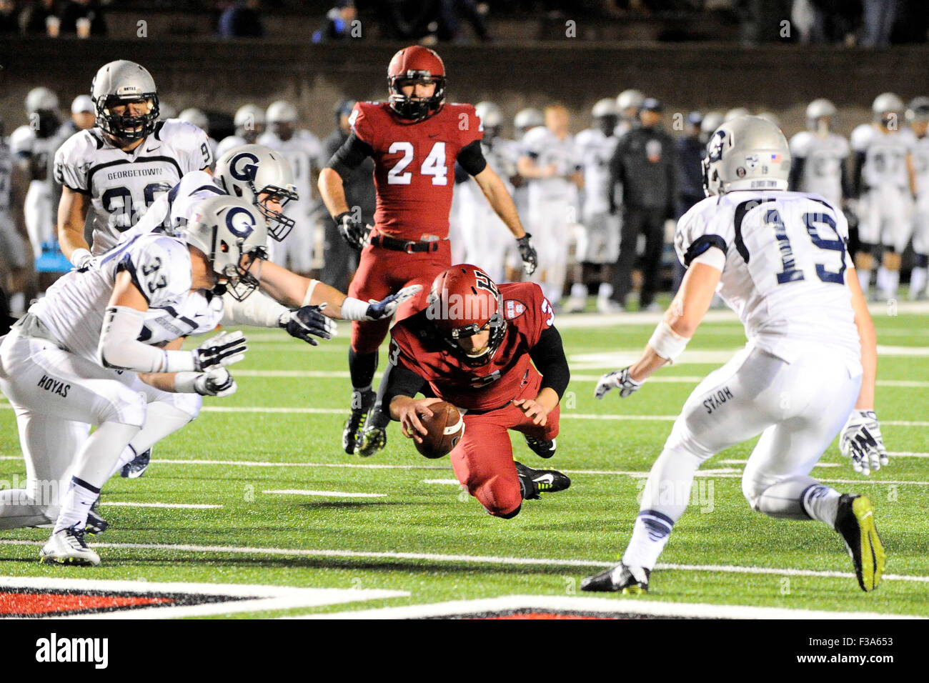 OCT 2, 2015: Harvard Crimson quarterback Scott Hosch (3) dives for the ...