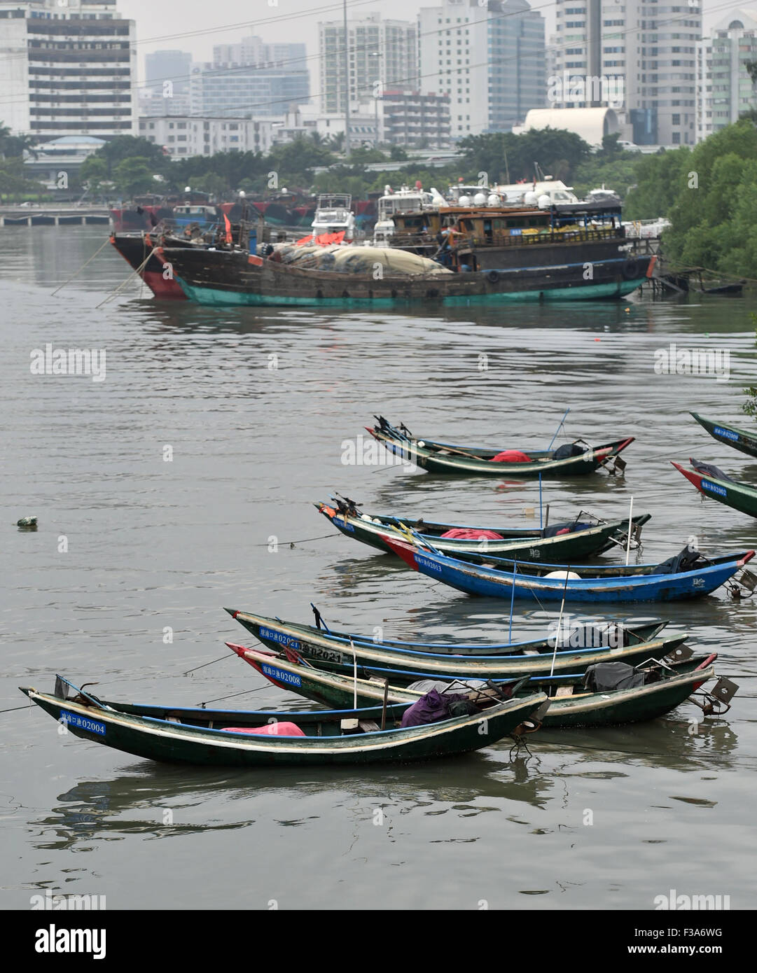 Haikou, China's Hainan Province. 3rd Oct, 2015. Ships berth at a harbor ...