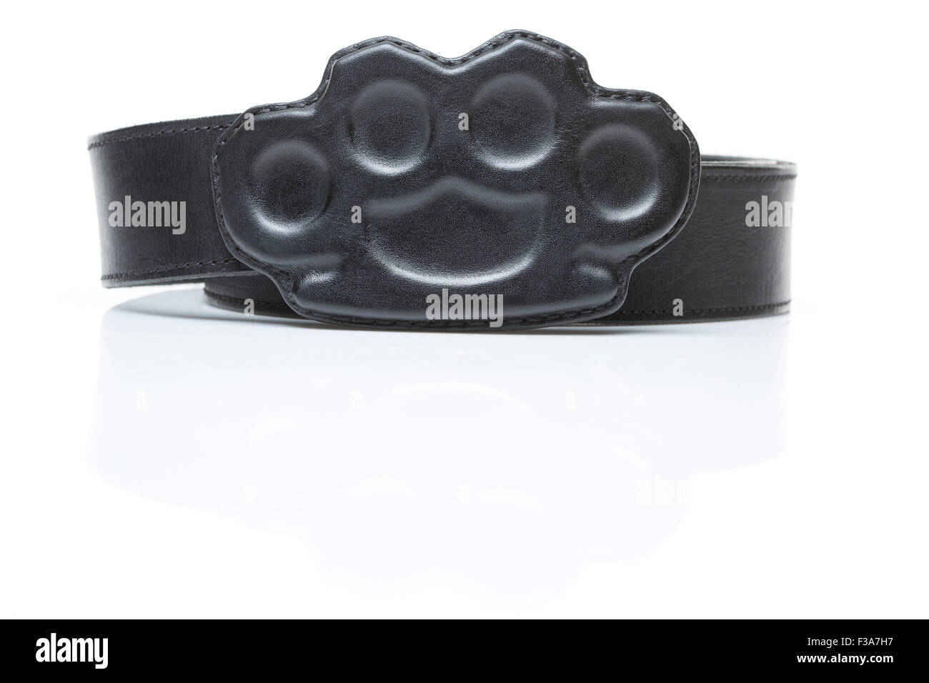 black belt with a buckle in the form of brass knuckles Stock Photo - Alamy