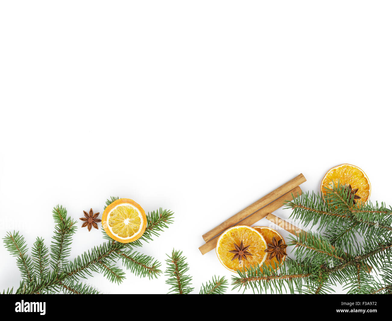 fir twig with dried orange slice on white background Stock Photo - Alamy