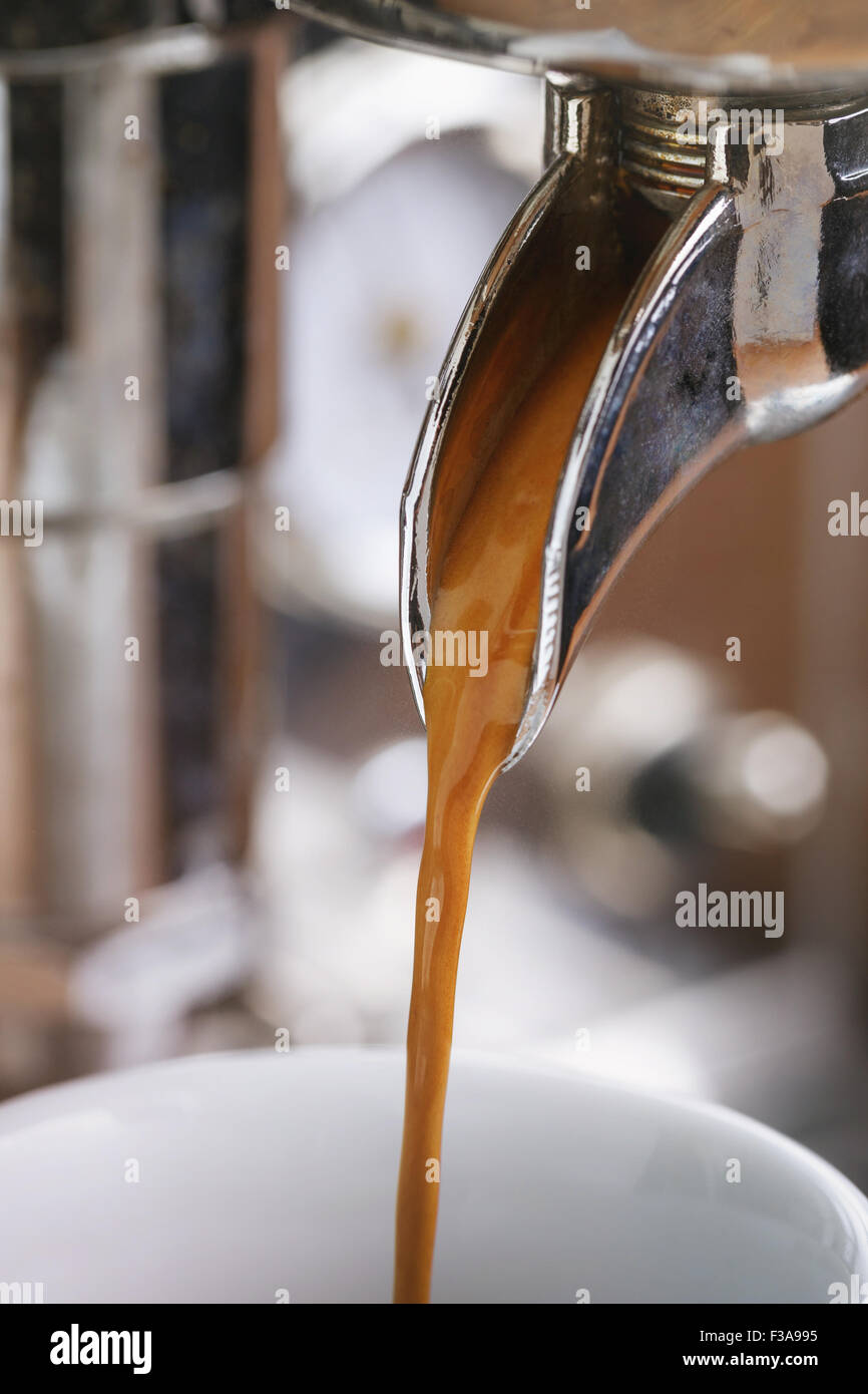 coffee extraction from professional coffee machine Stock Photo - Alamy