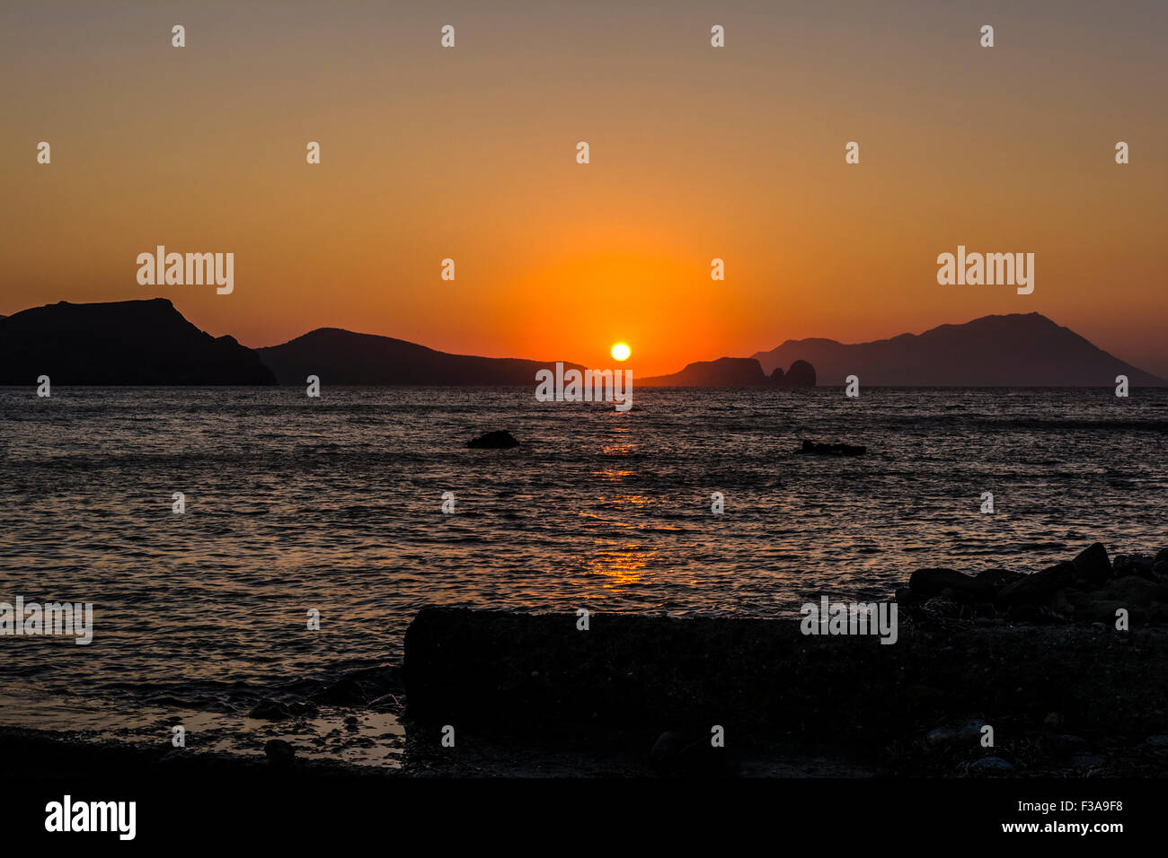 Beautiful sunset at a beach of Greek island of Milos Stock Photo - Alamy