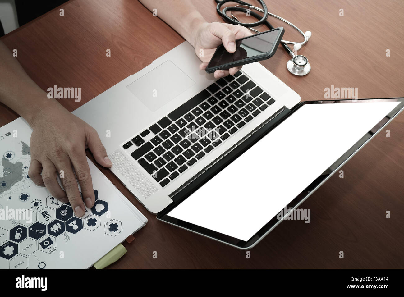 top view of Medicine doctor hand working with modern computer and smart ...