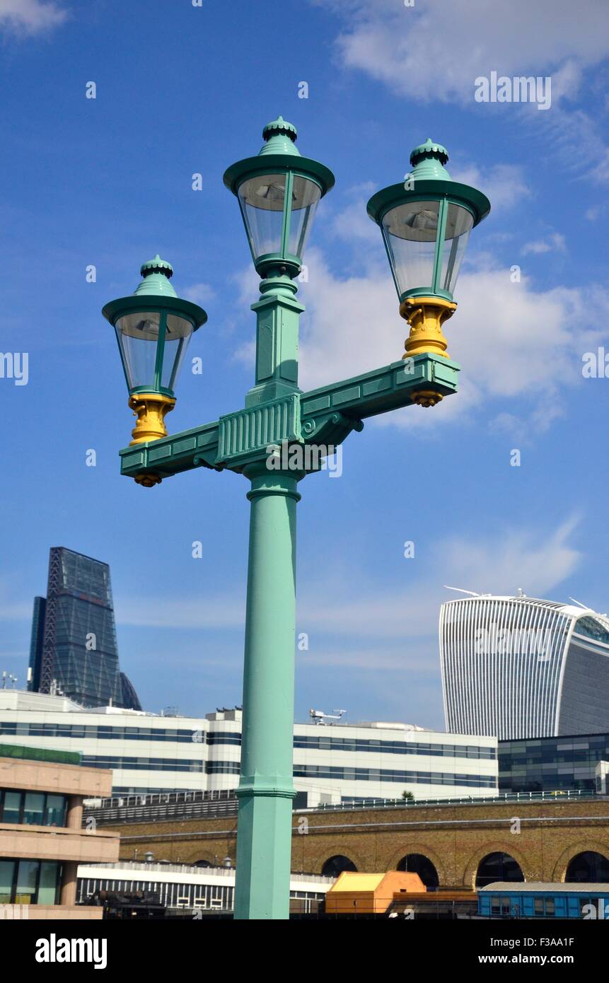 Lampost on Southwark Bridge with the City of London in the background ...