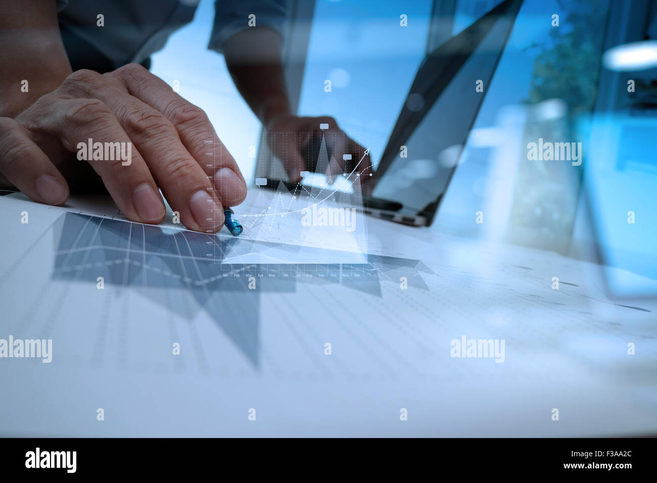 Double exposure of businessman hand working with new modern computer ...