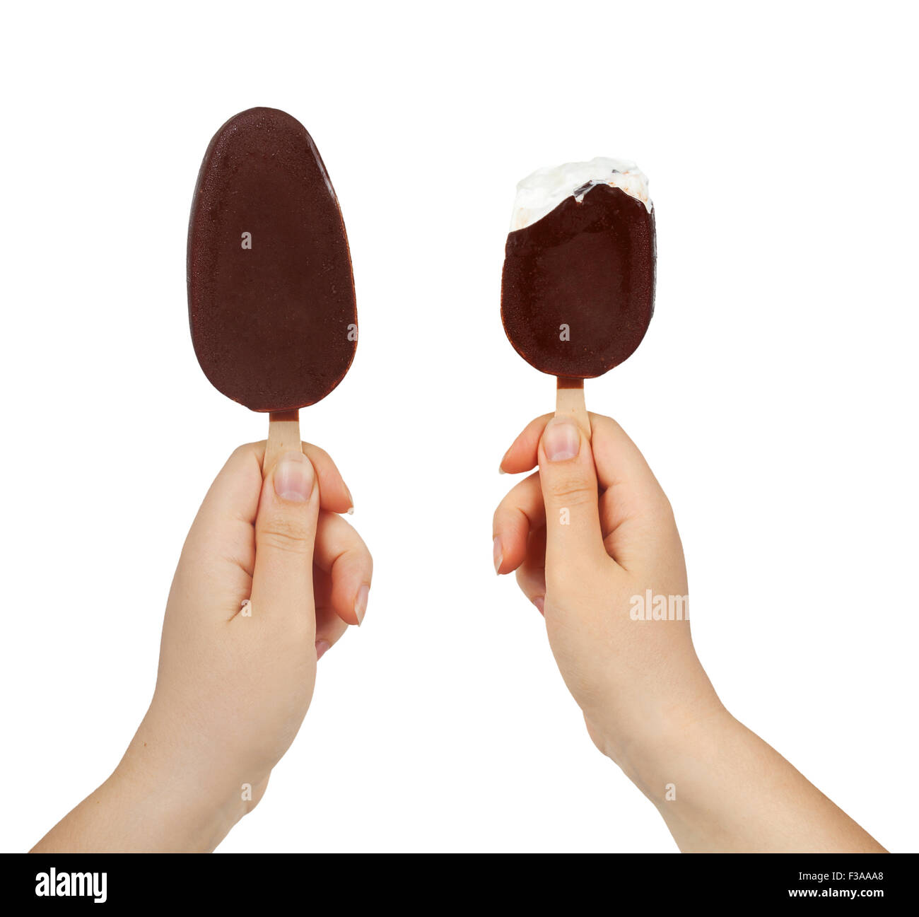 Two female hands holding two ice cream isolated on white background ...
