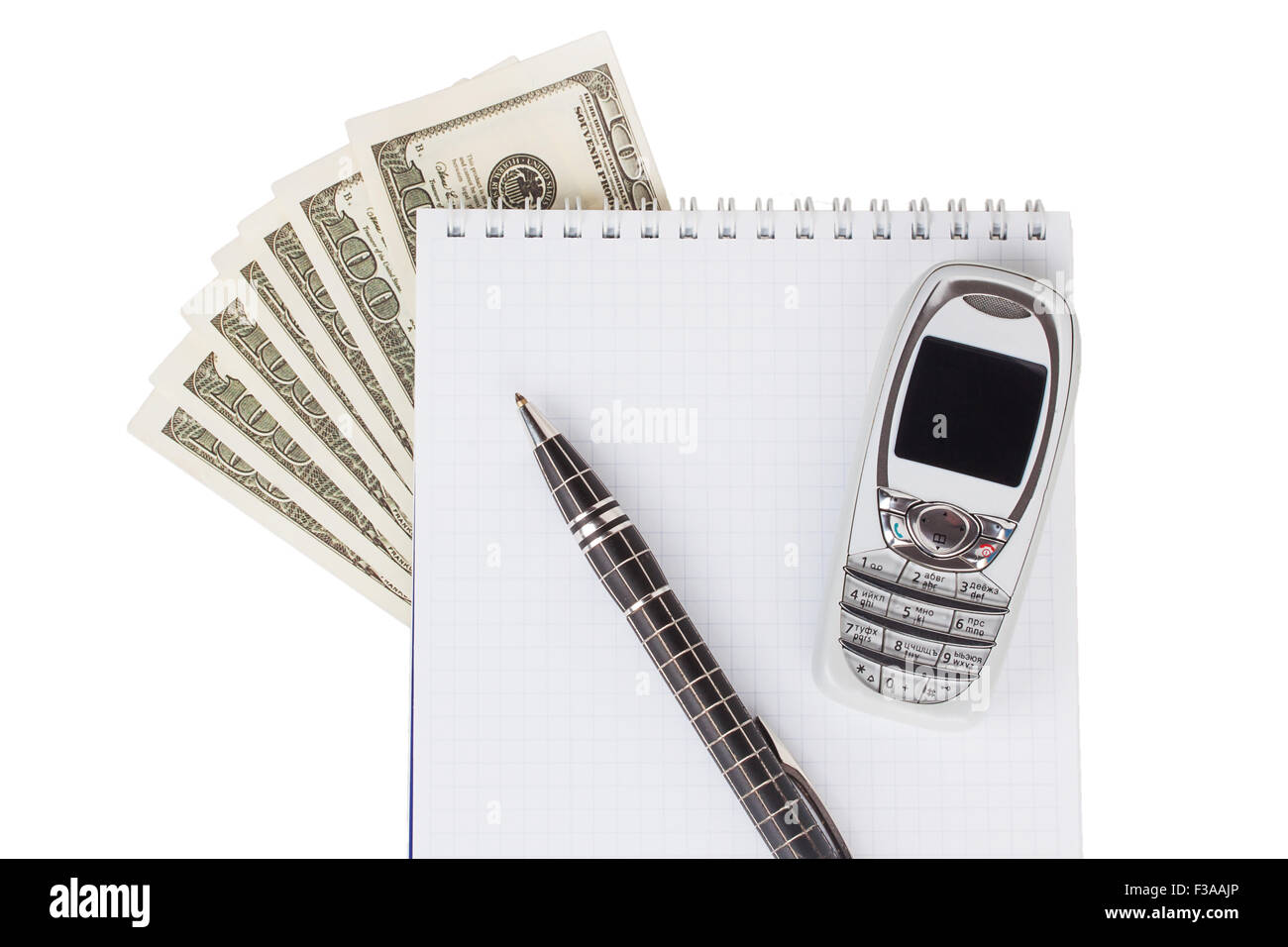 dollars, notepad, pen and mobile phone on a white background Stock ...