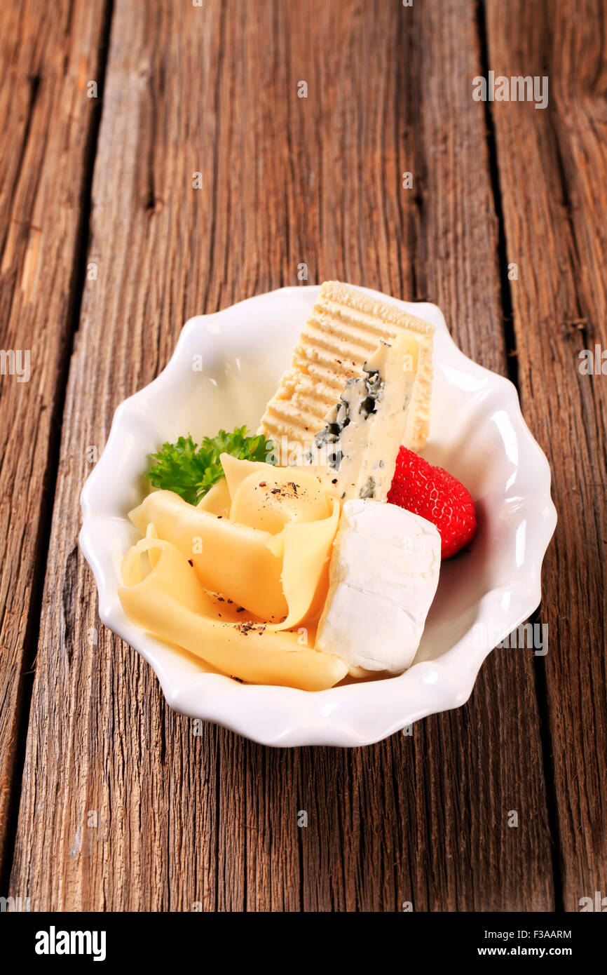 Various types of cheese in a serving bowl Stock Photo - Alamy