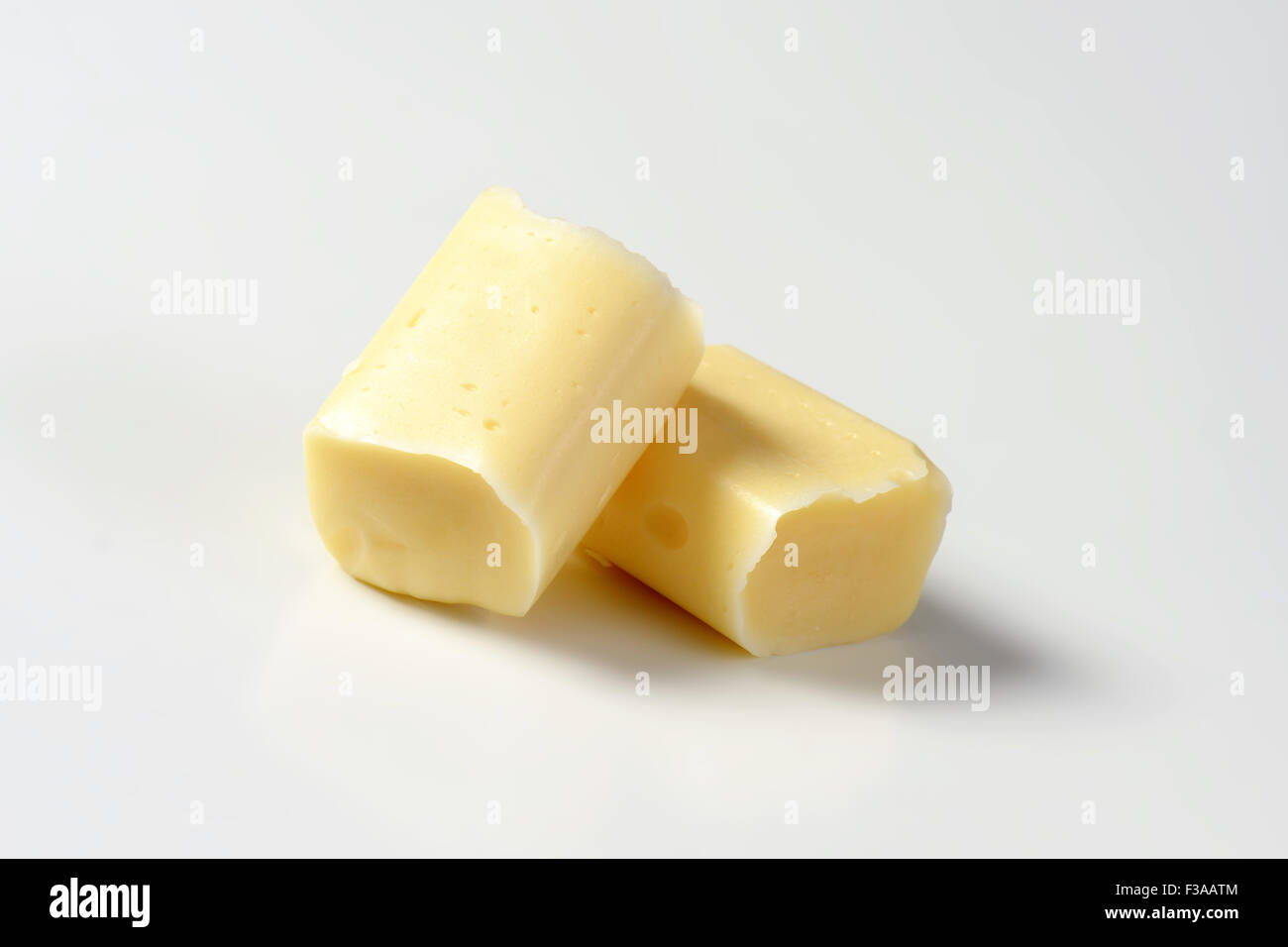 two milk toffee candies on white background Stock Photo - Alamy