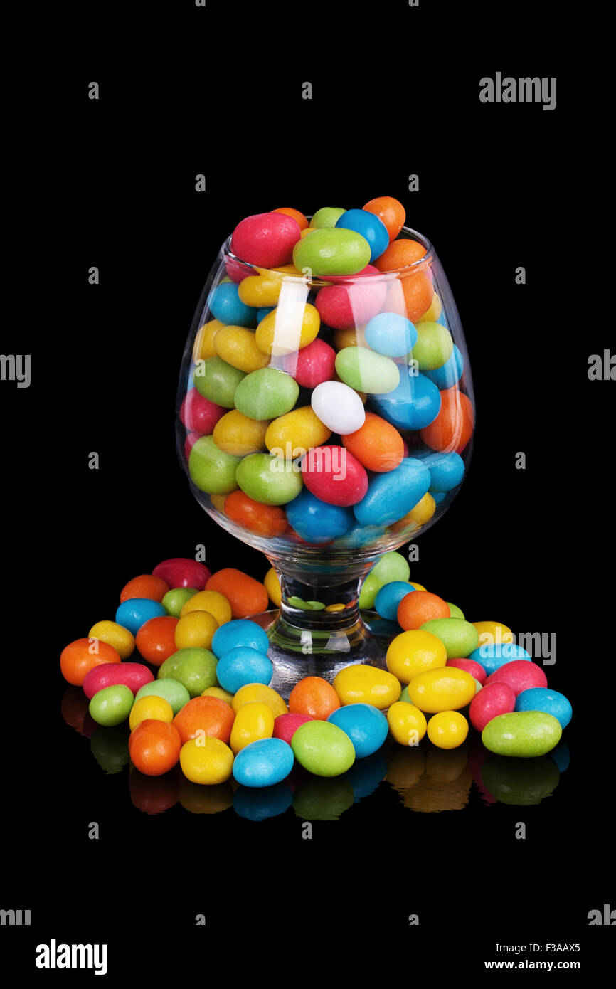 colorful candy in glass isolated on black background Stock Photo - Alamy