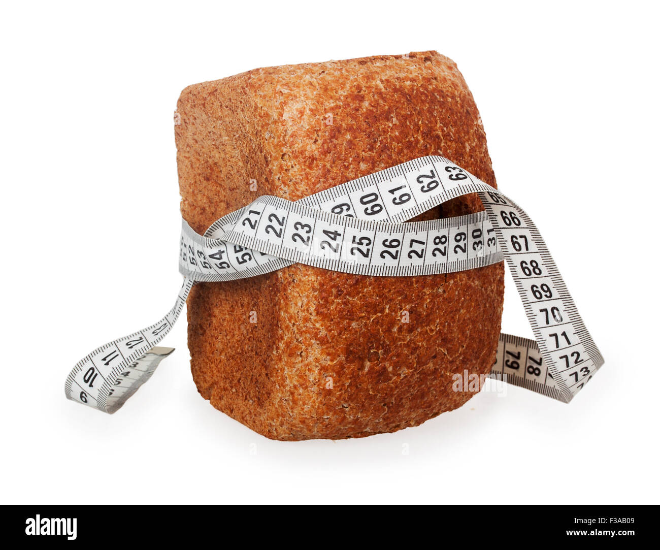 White tape measure wrapped around whole wheat bread isolated on white ...